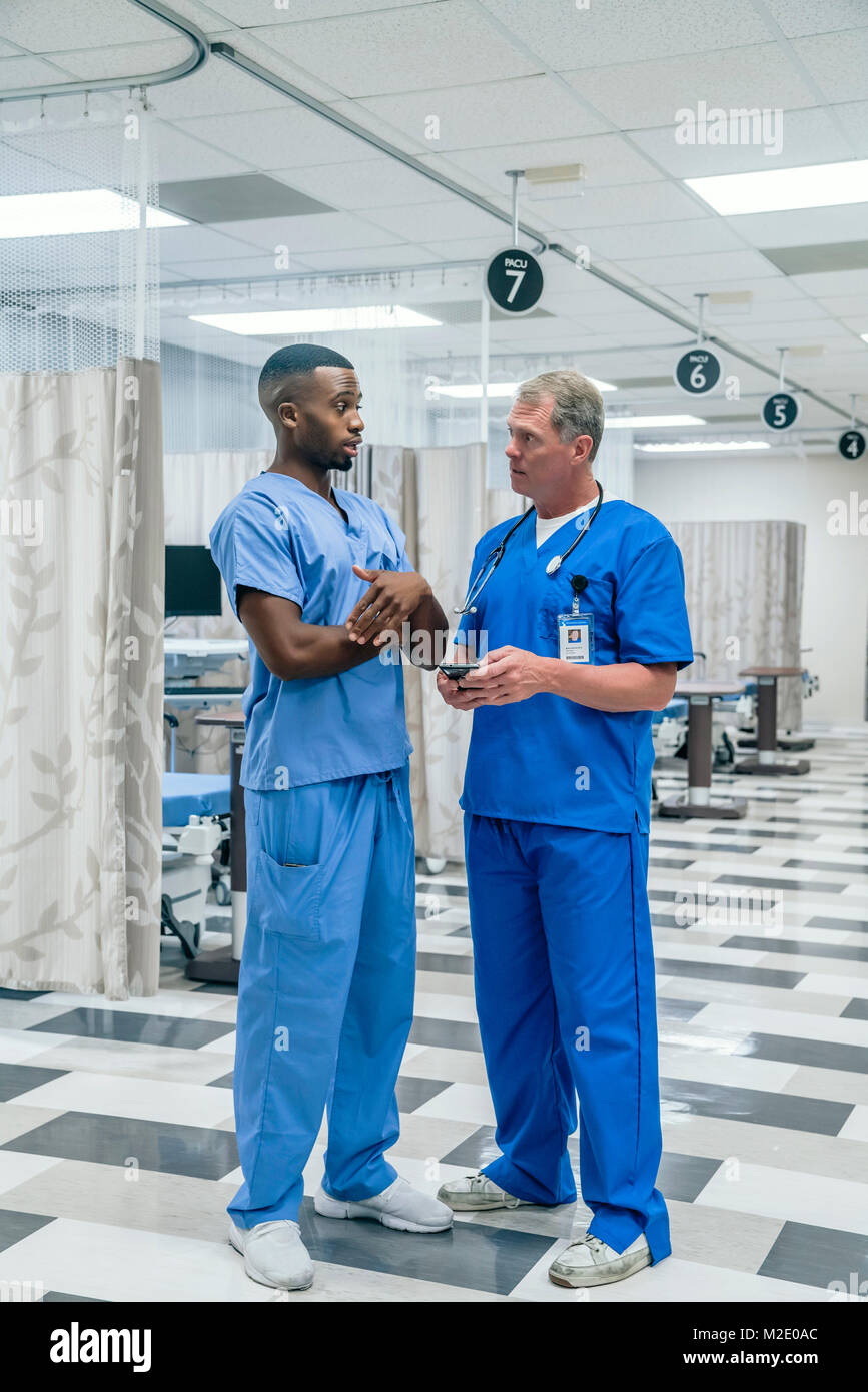 Doctors talking in hospital Stock Photo - Alamy
