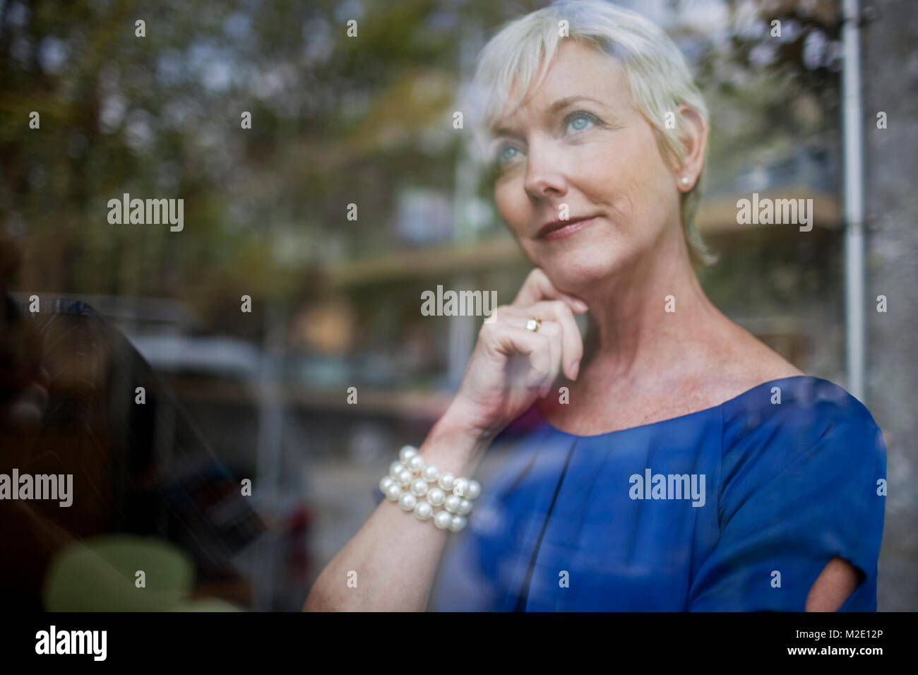 Pensive Caucasian businesswoman looking out window Stock Photo - Alamy Pensive Caucasian businesswoman looking out window Stock Photo - Alamy