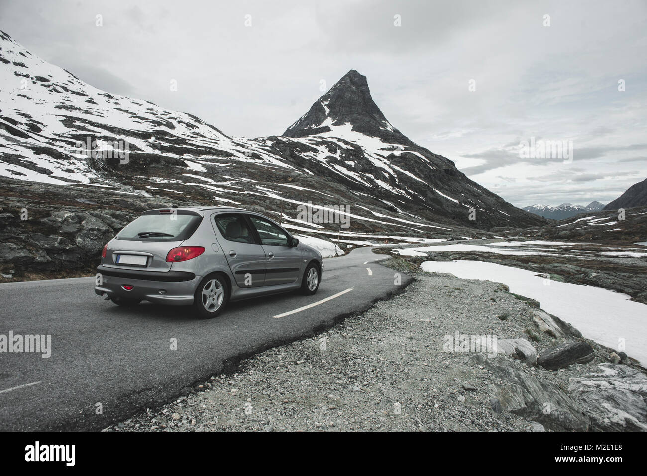 Car driving on road in winter landscape Stock Photo - Alamy