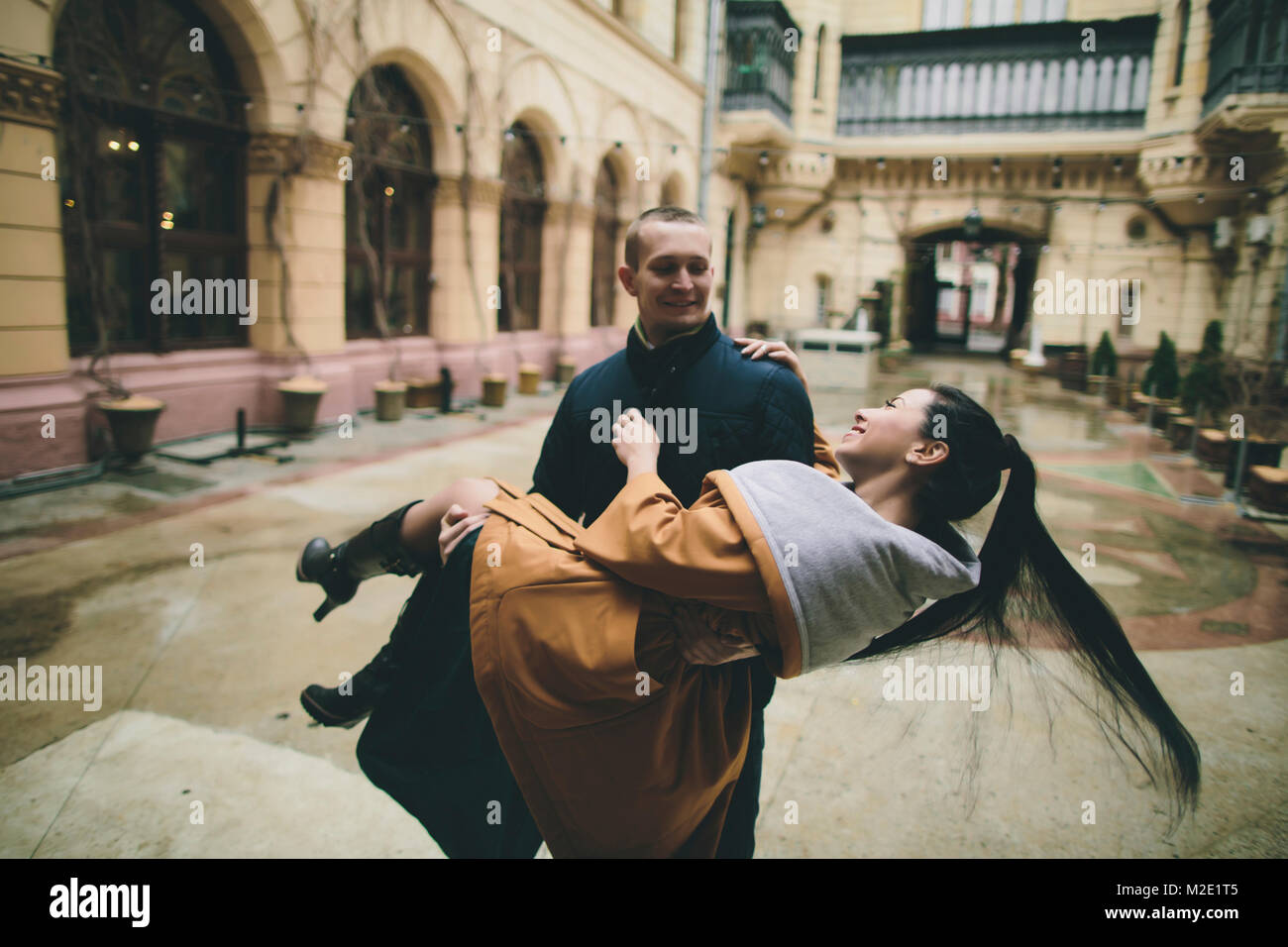Man carrying lifting woman up hi-res stock photography and images - Alamy