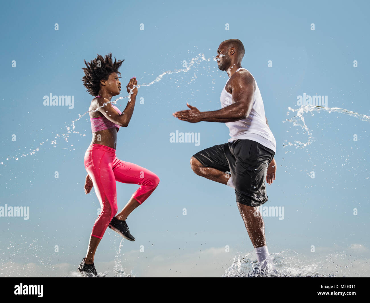 Woman splashing water face side view hi-res stock photography and ...