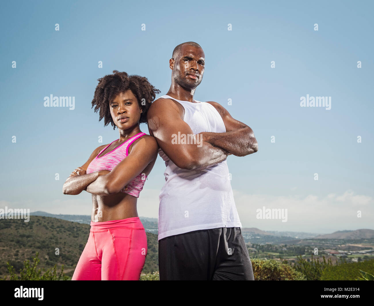 Portrait of confident sweating Black couple standing in landscape Stock ...