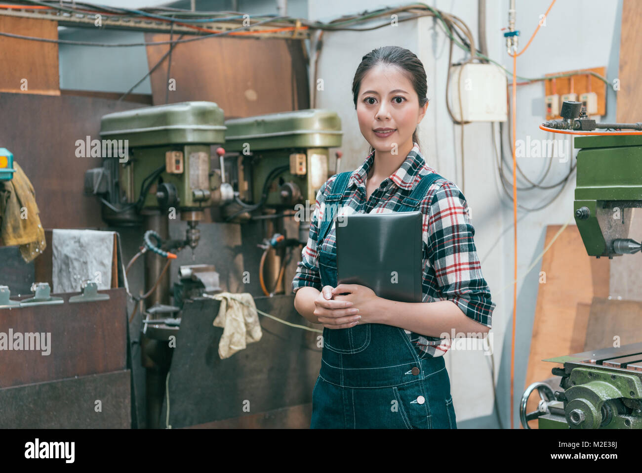 professional confident milling machine factory female worker working ...