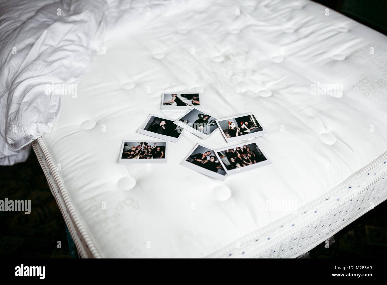 Photographs on bed mattress Stock Photo - Alamy