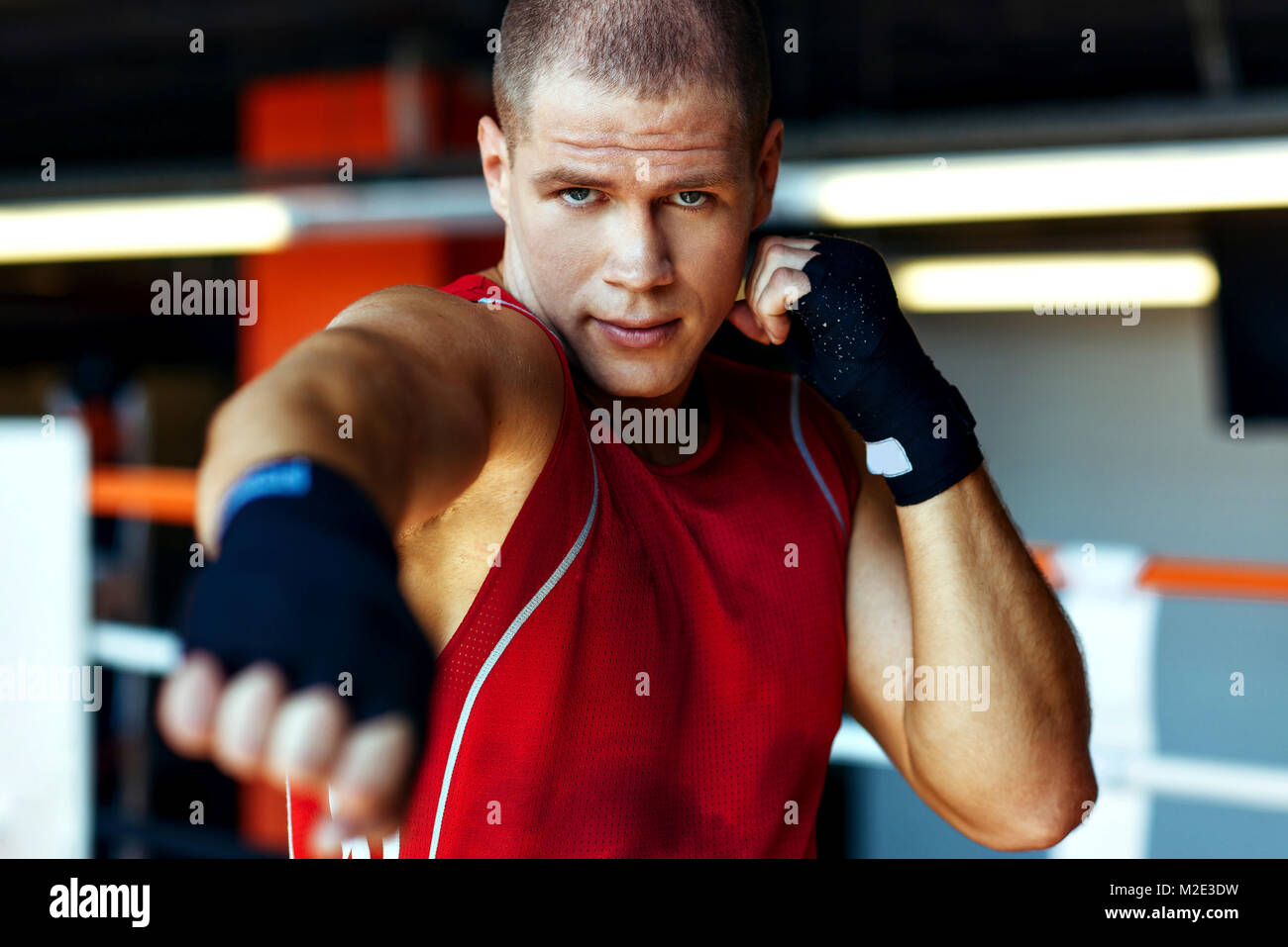 Portrait of Caucasian boxer punching Stock Photo - Alamy