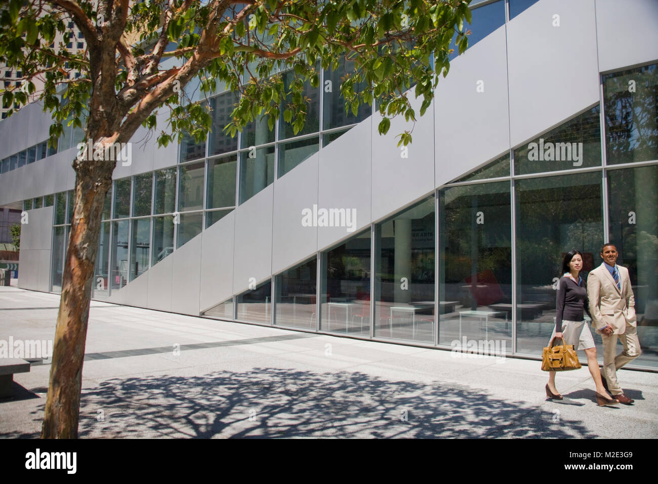 Business people walking near building Stock Photo - Alamy