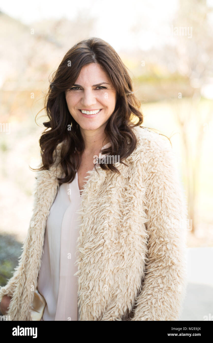 Beautiful middle age woman smiling Stock Photo - Alamy