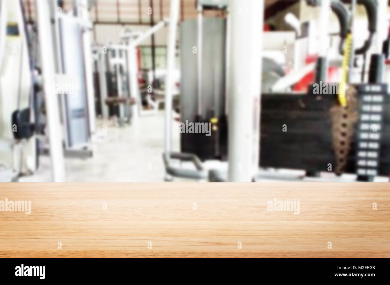 Wooden table on blurred background of fitness gym interior of modern ...