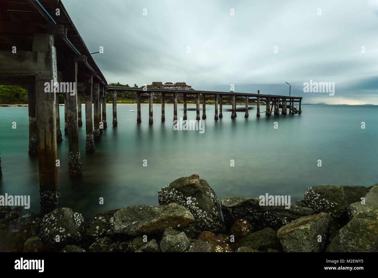 Wooden bridge on silky sea with silky rain clouds in rainy day Stock ...