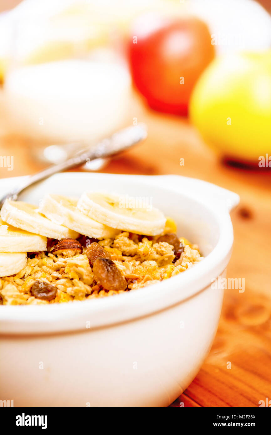 Healthy breakfast. Muesli with banana,raisins and milk Stock Photo - Alamy