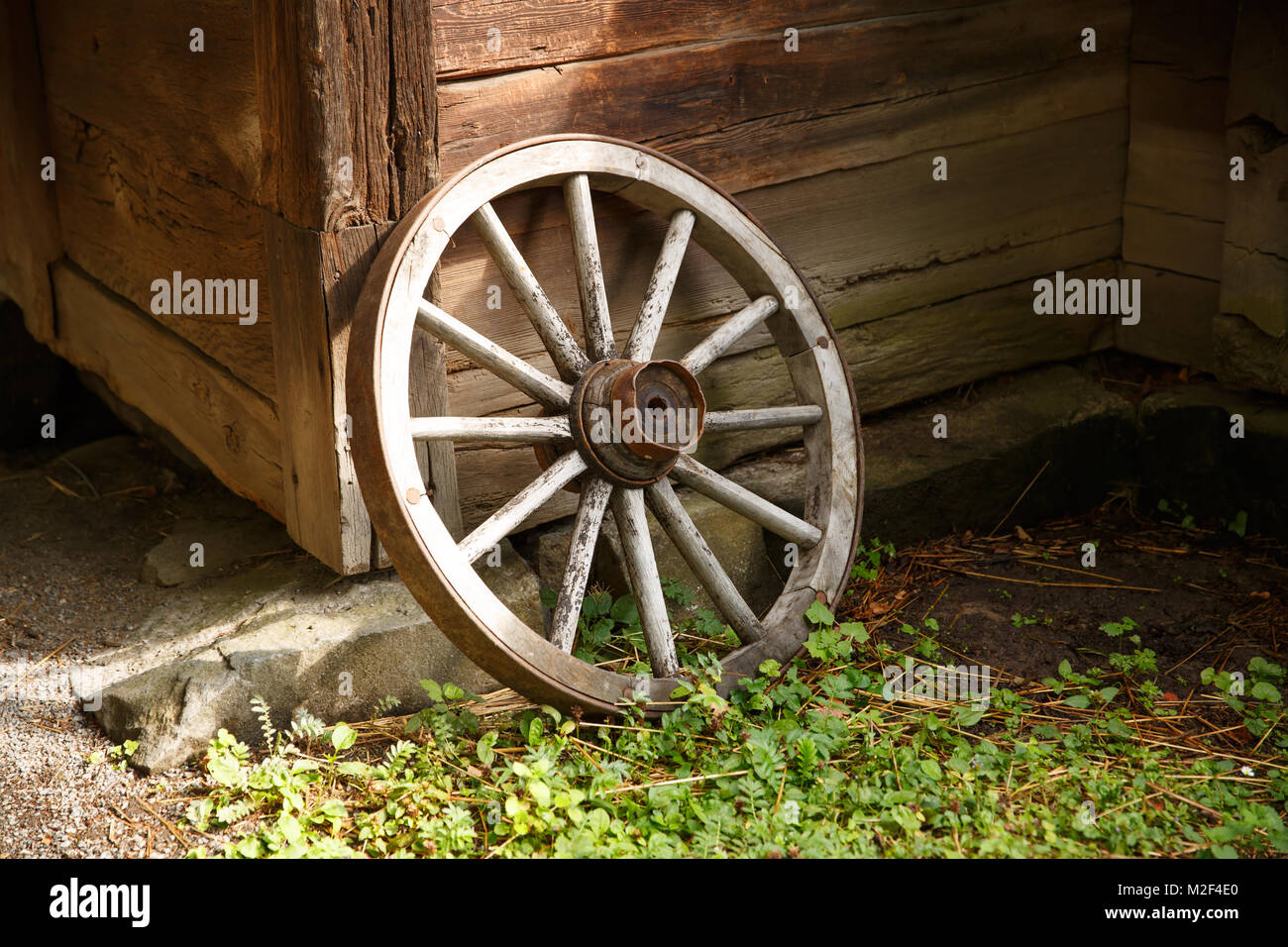 Old wheel at the traditional Sweden house Stock Photo - Alamy