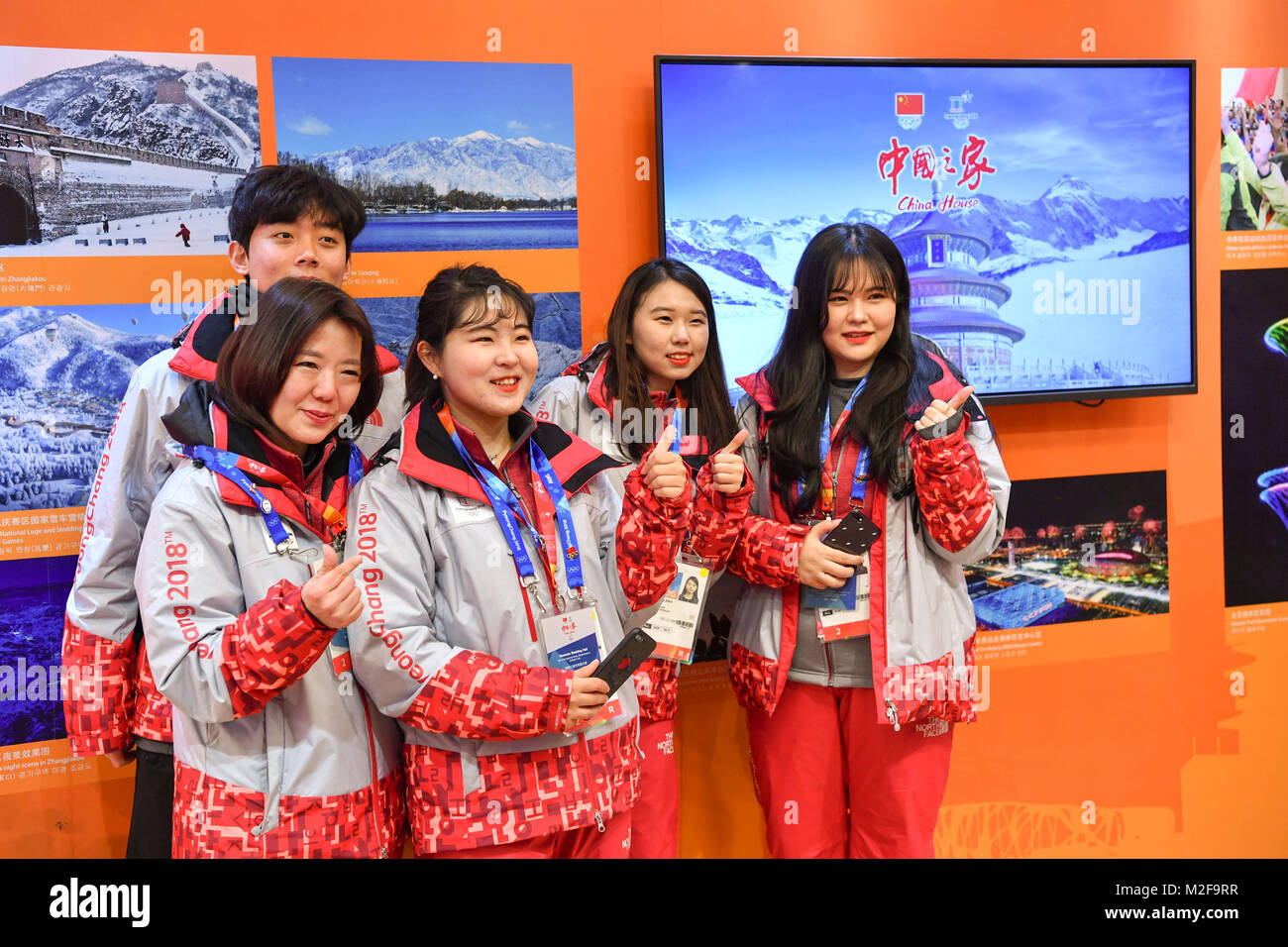 Pyeongchang, South Korea. 7th Feb, 2018. Volunteers pose for photos at ...