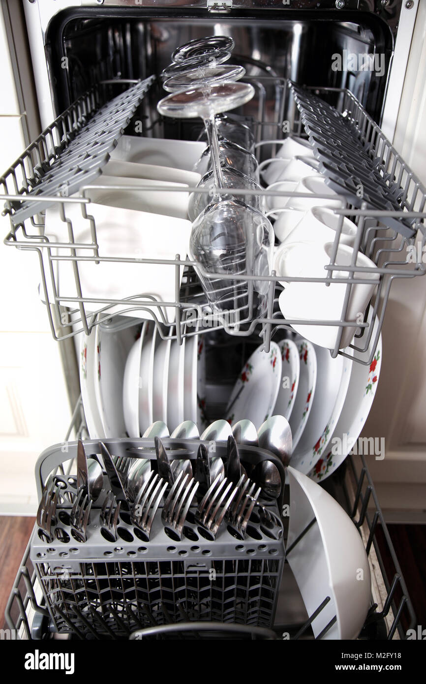 Open dishwasher with clean utensils Stock Photo - Alamy