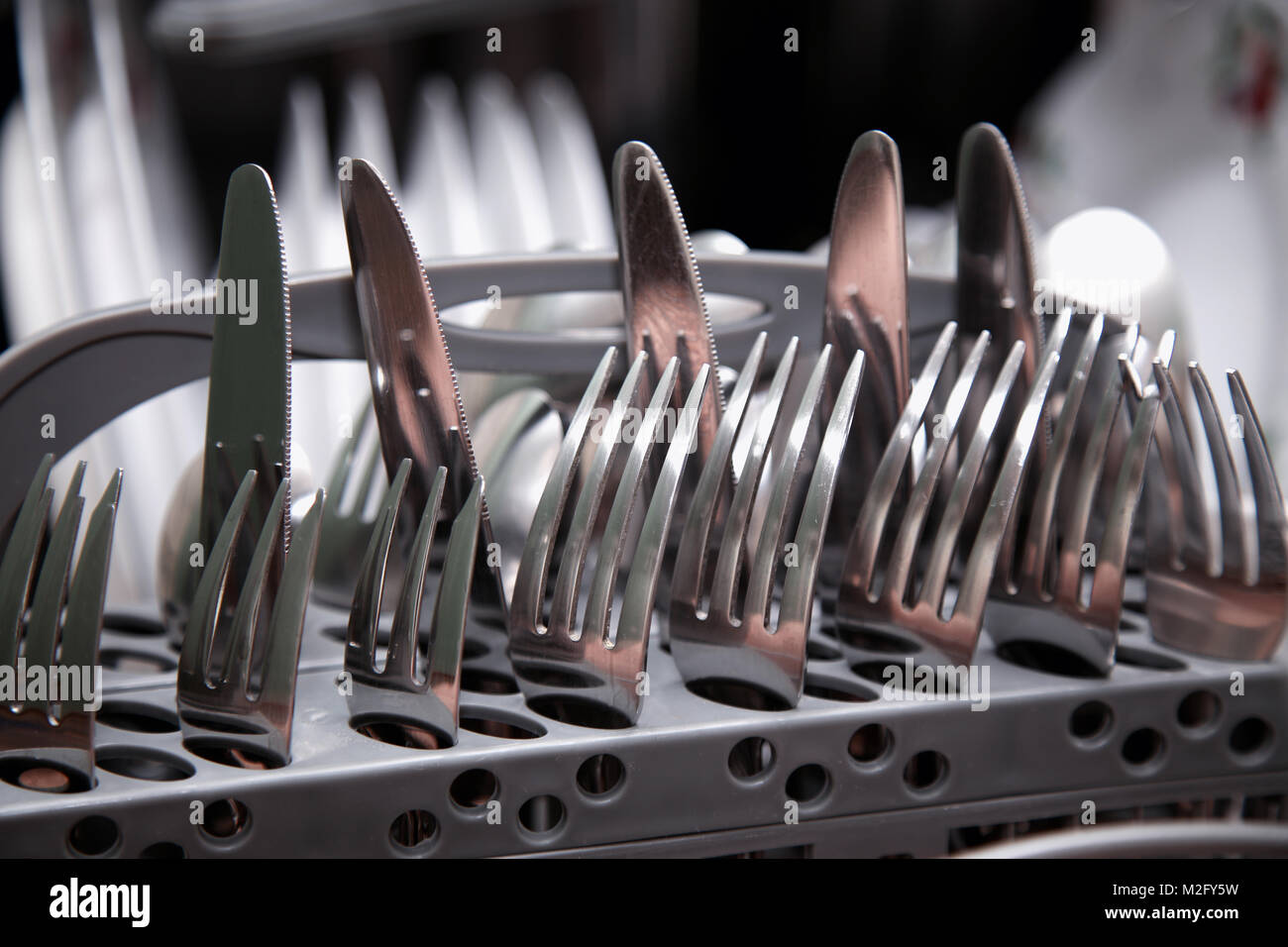 Open dishwasher with clean utensils Stock Photo - Alamy