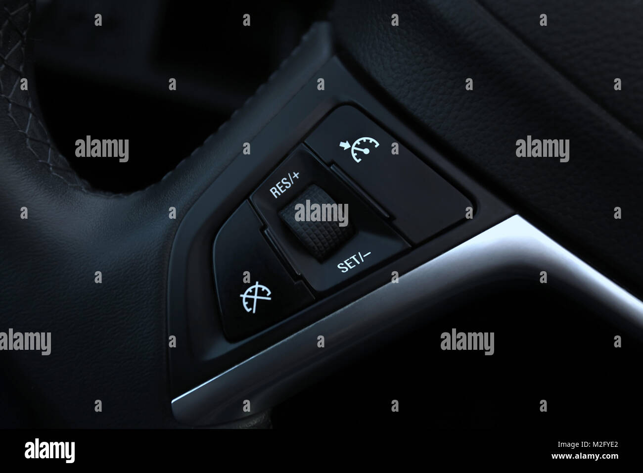 speed limitation and cruise control buttons on a steering wheel in ...