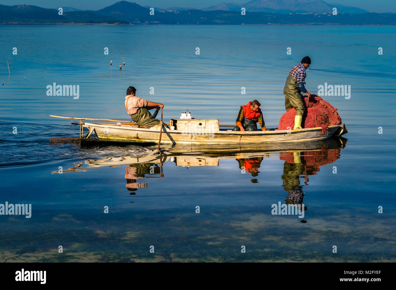 Aitoliko Greece, December 24 2016-fishermen on a traditional wooden ...