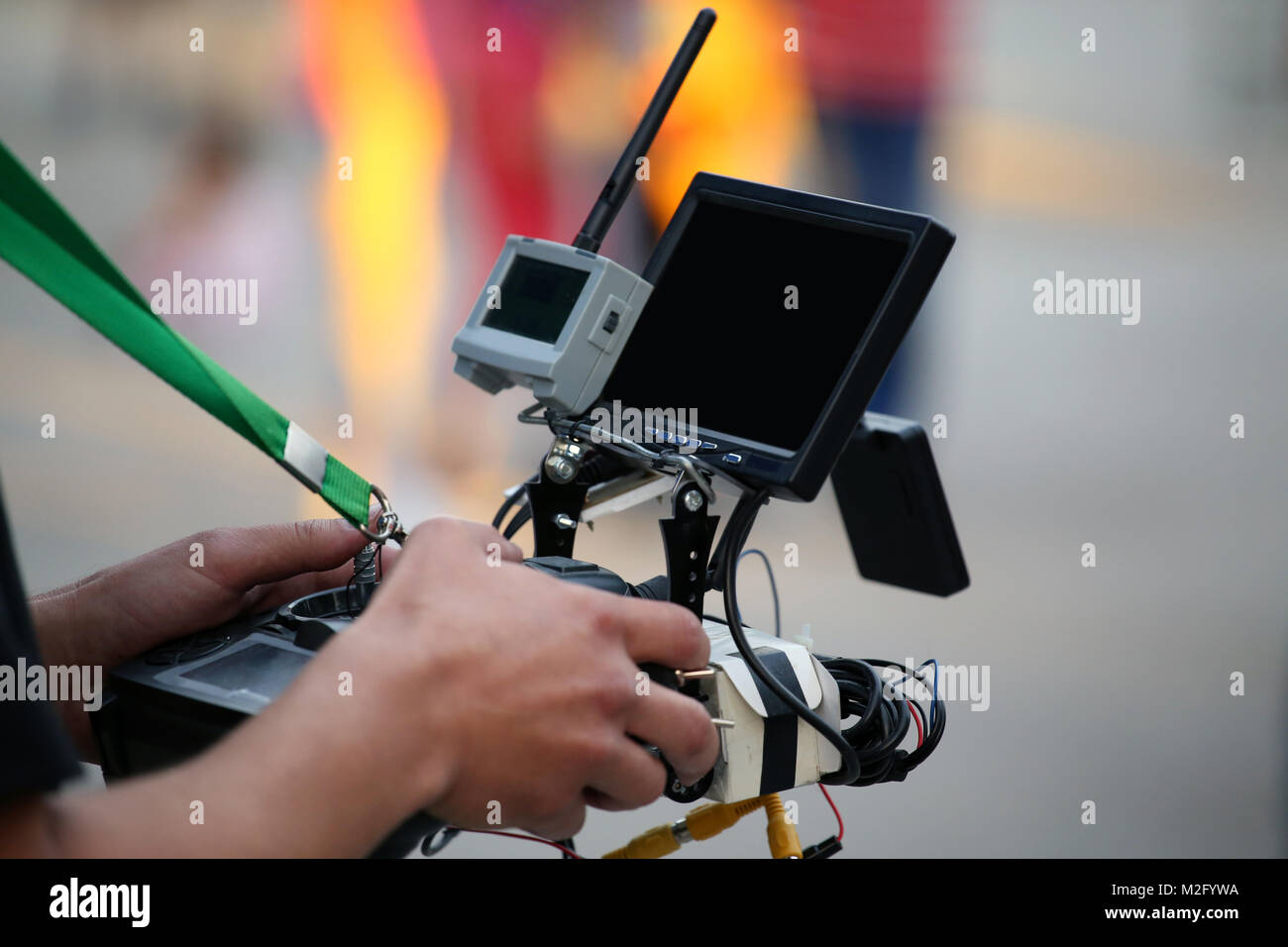 Details an professional operator holding a remote control with ...