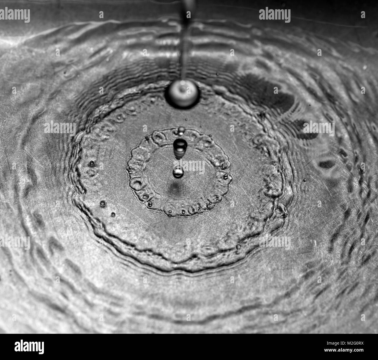 water droplets dropping into a stainless steel sink Stock Photo - Alamy