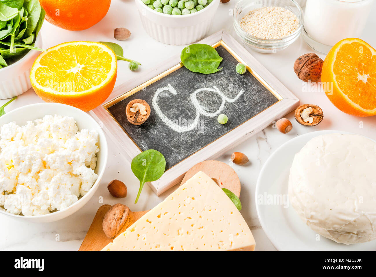 Healthy food concept. Set of food rich in calcium - dairy and vegan Ca ...