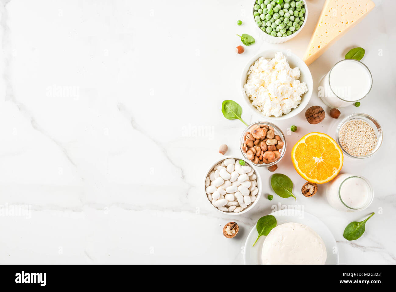 Healthy food concept. Set of food rich in calcium - dairy and vegan Ca ...