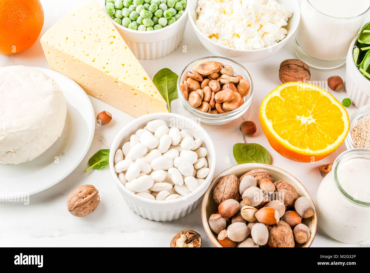 Healthy food concept. Set of food rich in calcium - dairy and vegan Ca ...