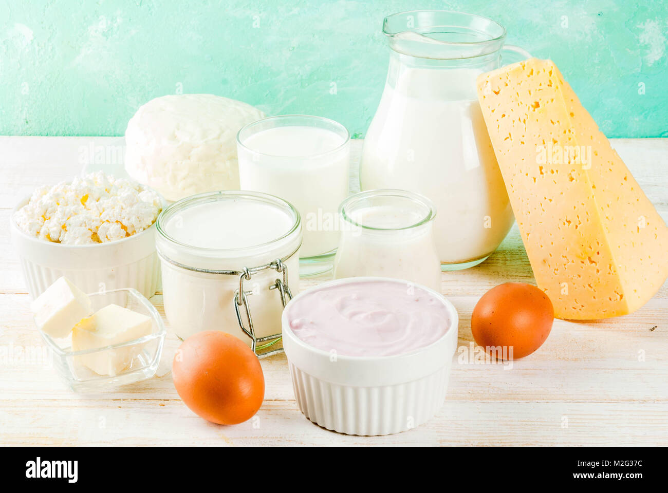 Healthy food concept. Set of dairy products light blue & white wooden ...