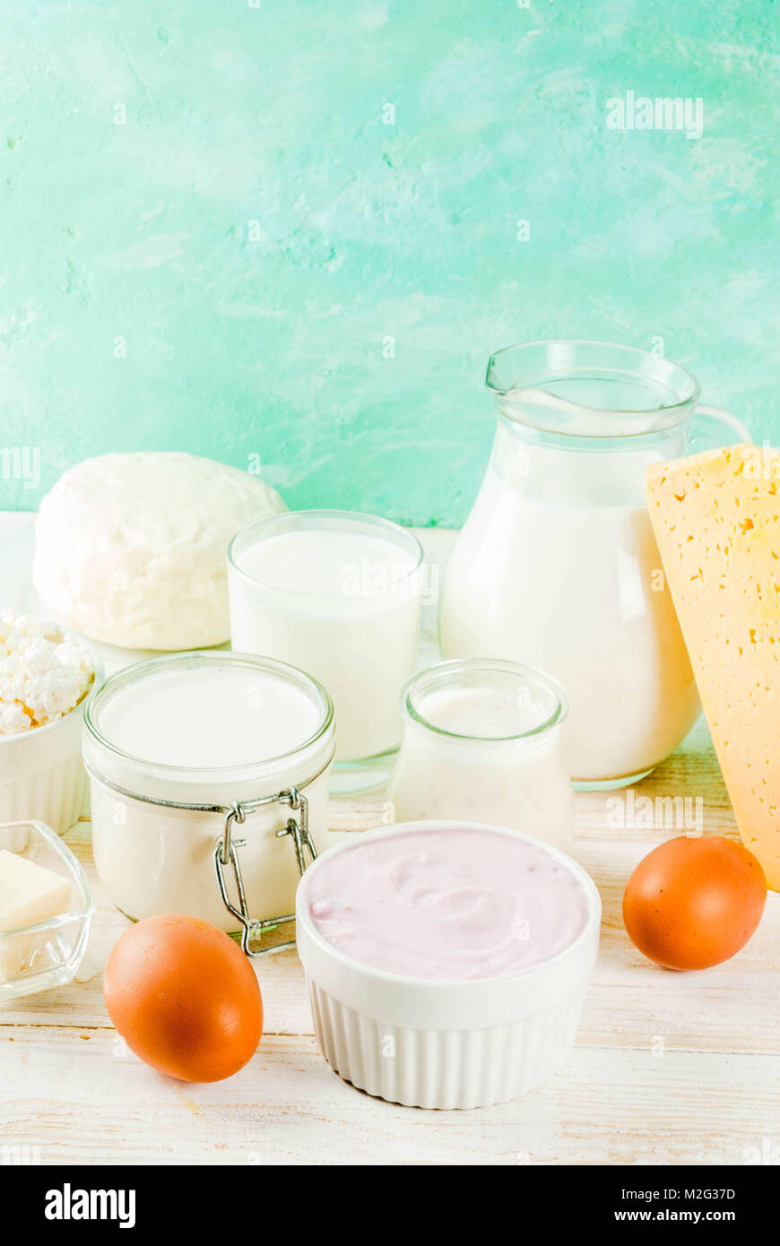 Healthy food concept. Set of dairy products light blue & white wooden ...