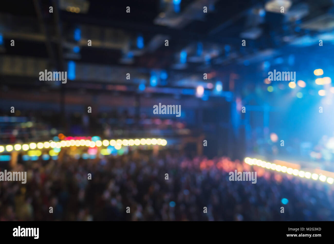 Blurred photo background, music concert hall with colorful illumination ...