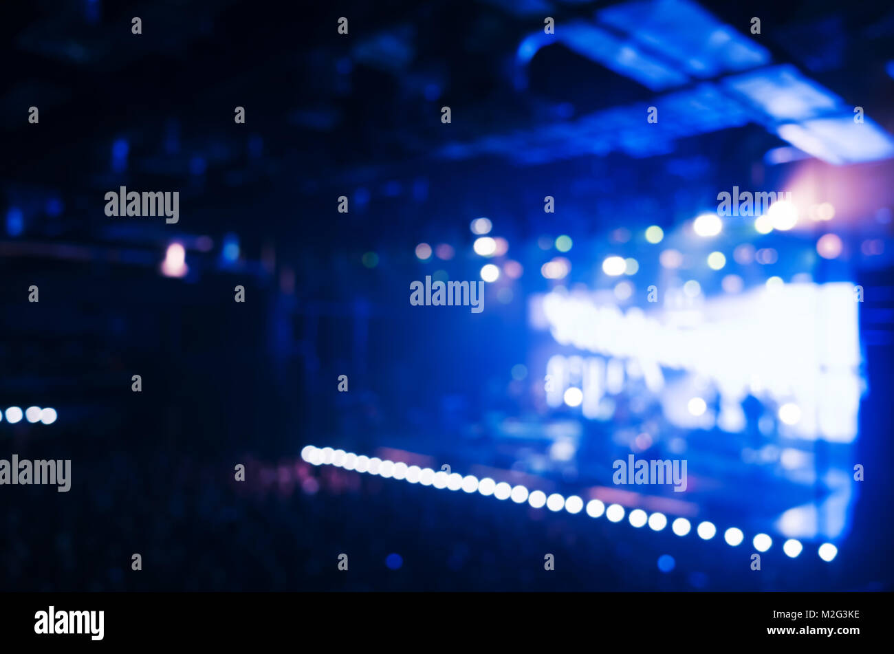 Blurred photo background, life music concert hall with blue ...