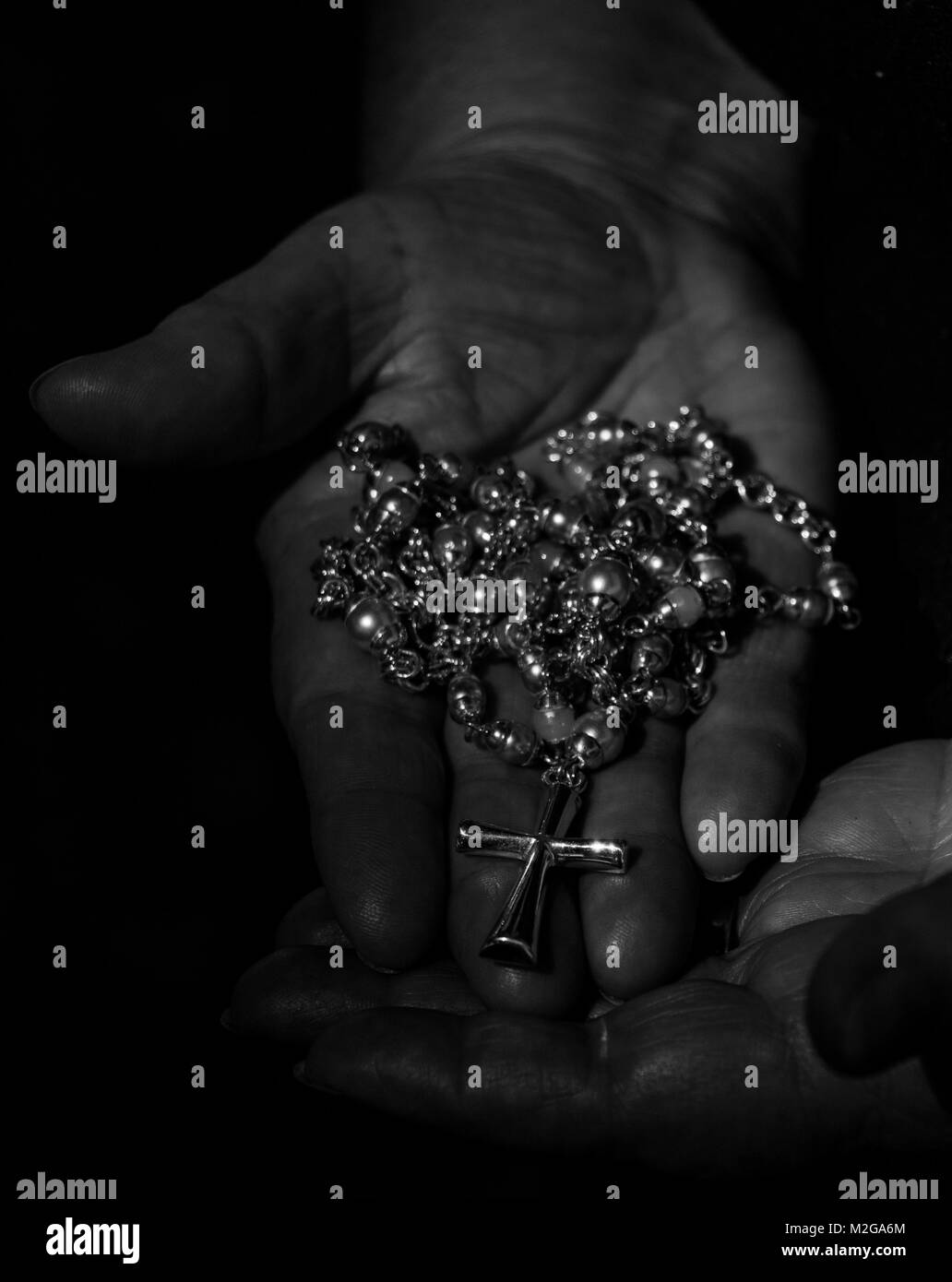 Crucifix hand woman hi-res stock photography and images - Alamy