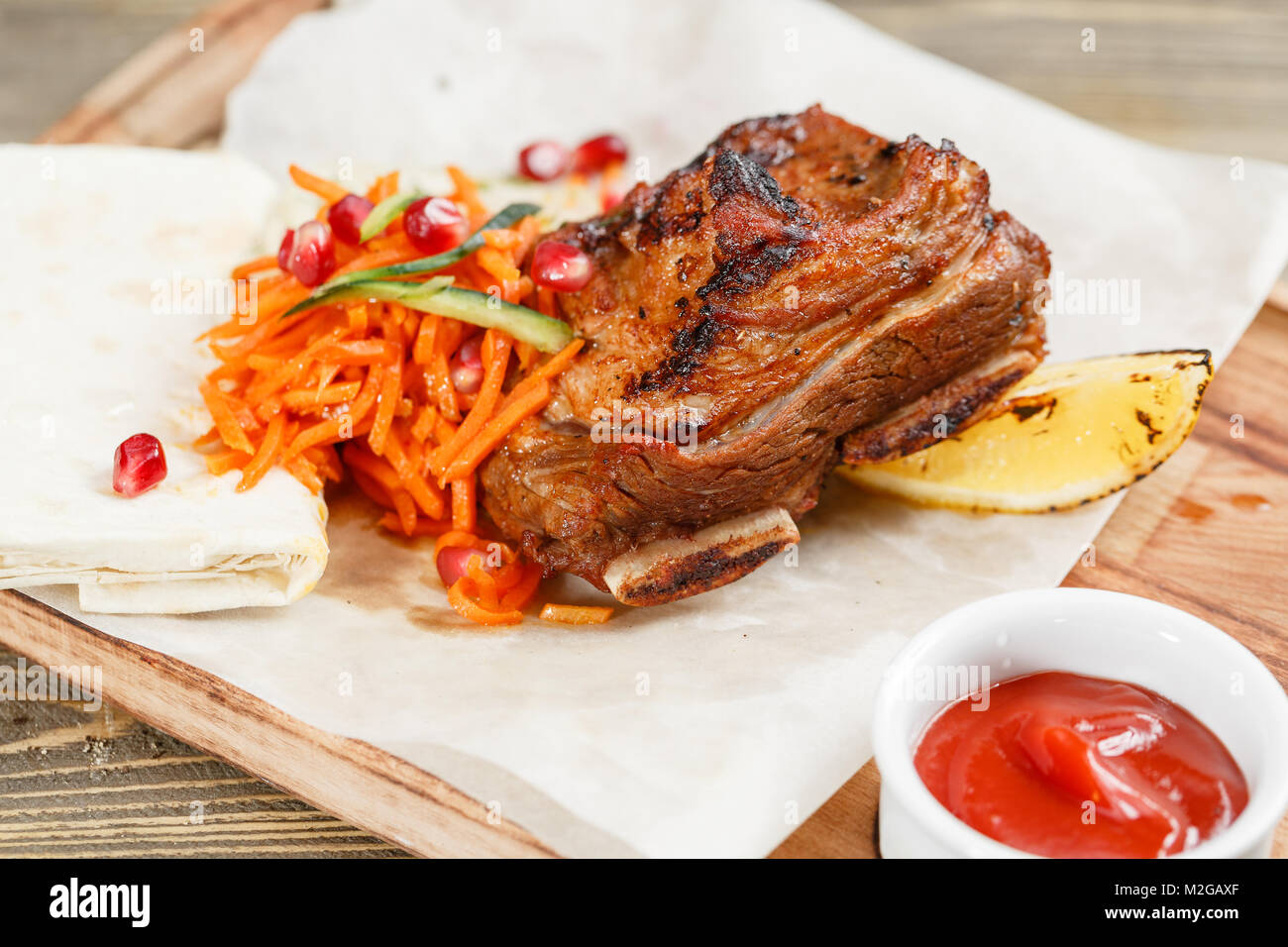 Beef ribs grill. Serving on a wooden Board on a rustic table. Barbecue ...