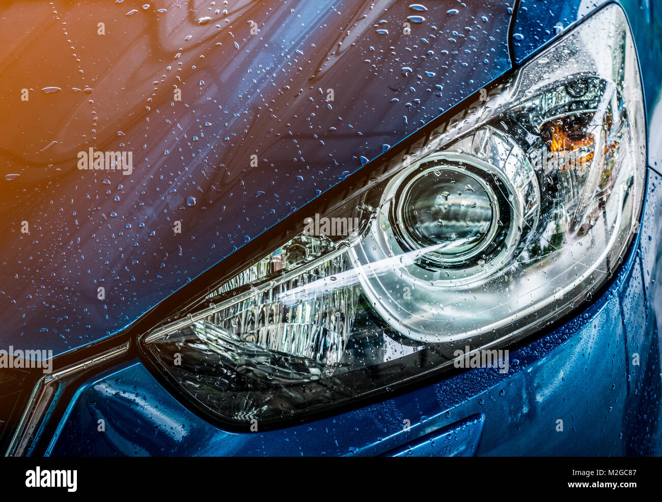 Blue compact SUV car with sport and modern design are washing with ...