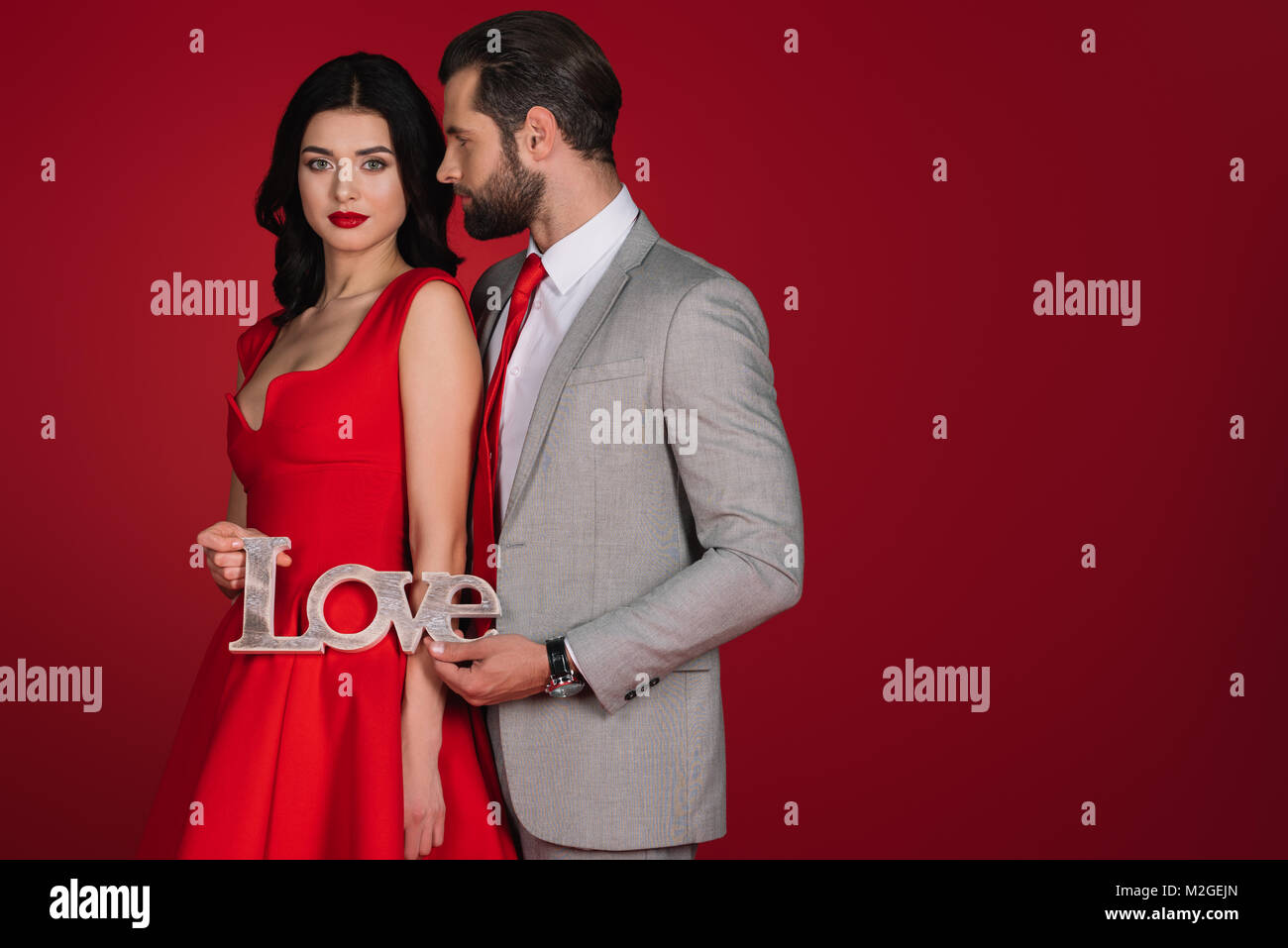 Couple holding love sign hi-res stock photography and images - Alamy