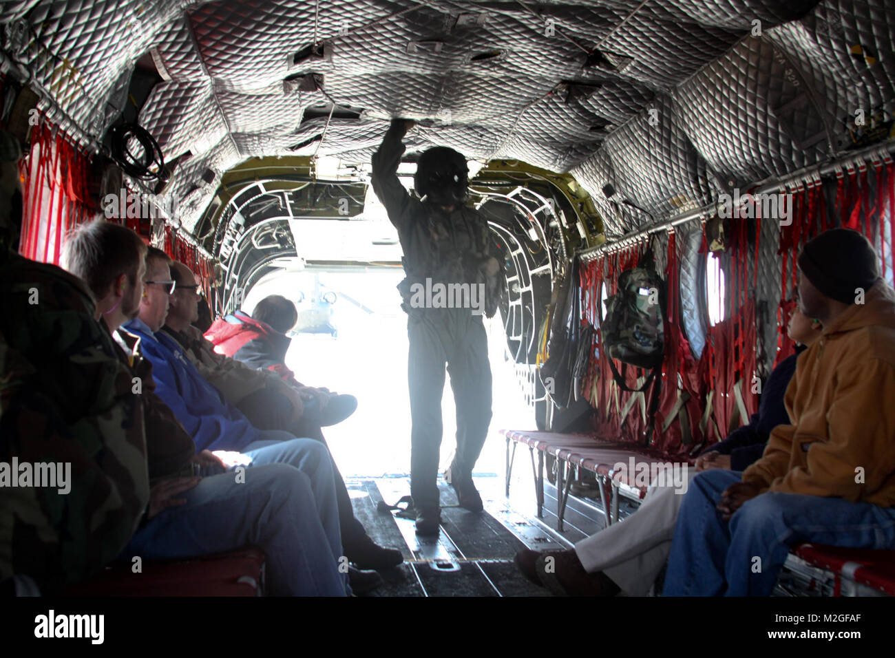 An Army CH-47 crewmember preps the aircraft for flight. The CH-47 ...