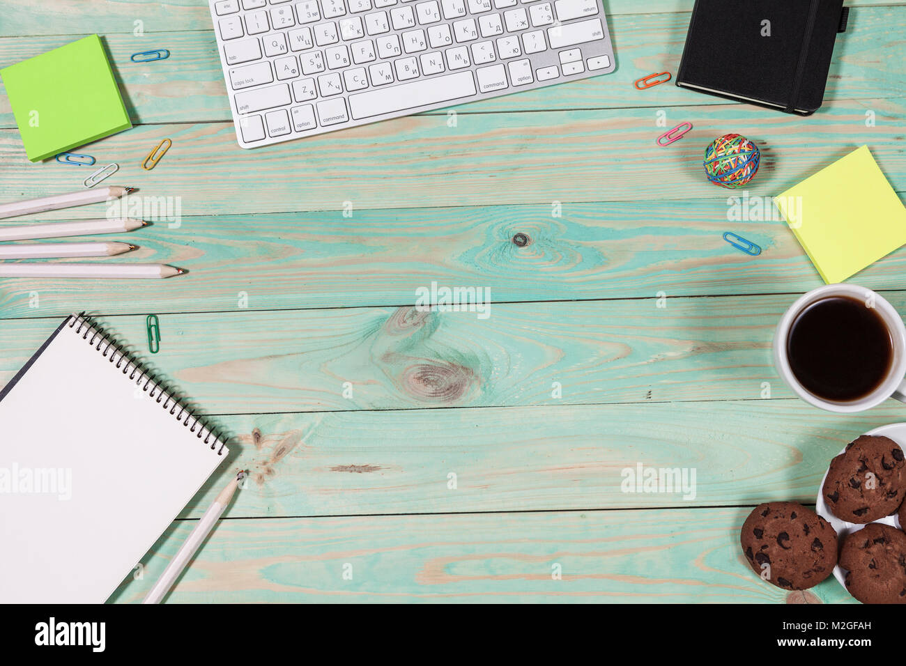 Blue office desk table with with office supplies. Top view with copy ...