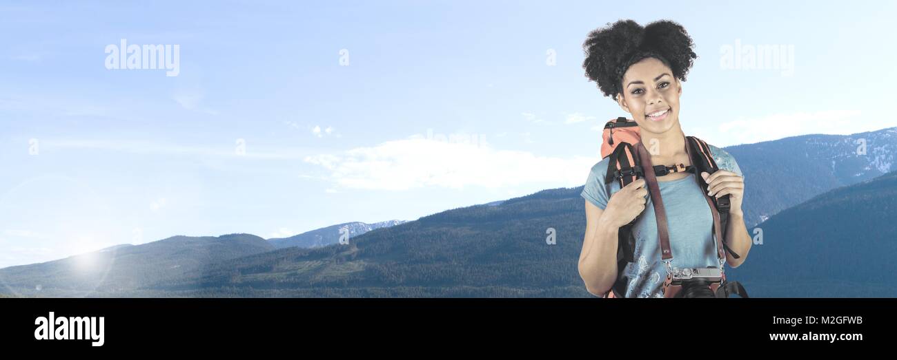 Travelling woman with bag in front of landscape Stock Photo - Alamy