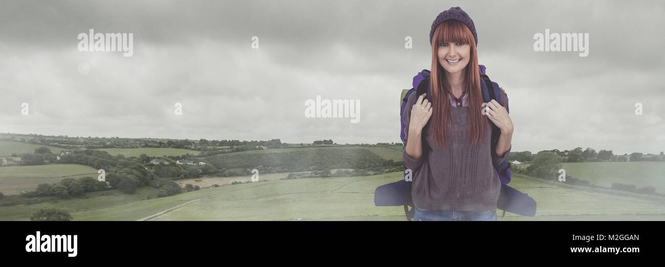 Travelling woman with bag in front of landscape Stock Photo - Alamy