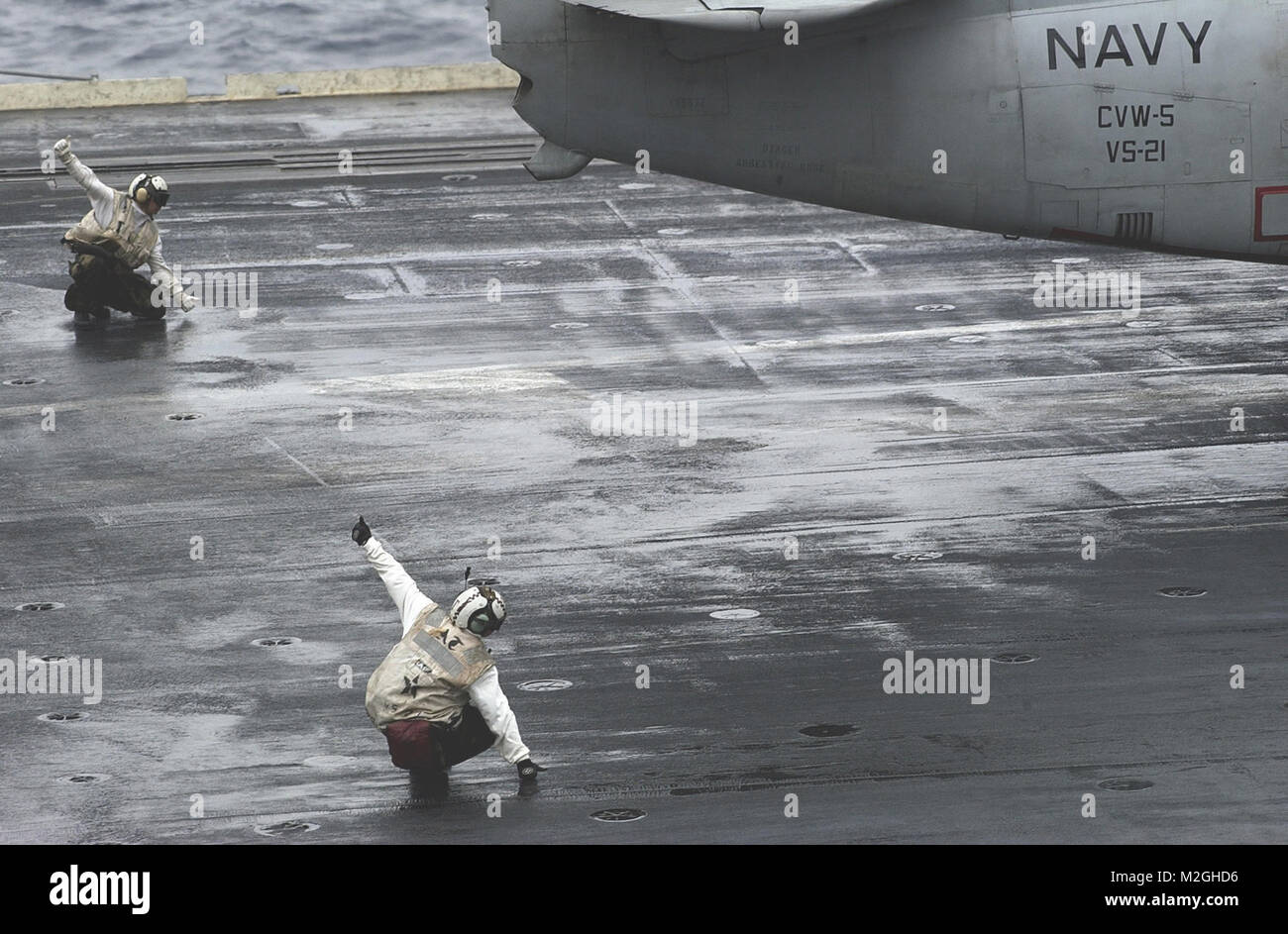 Two troubleshooters from Sea Control Squadron (VS) 21, the Redtails ...