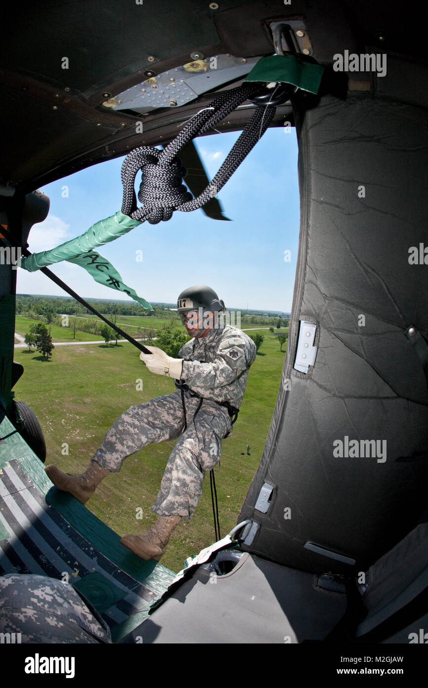 Students in the Army Air Assault School repel from a UH-60 helicopter ...