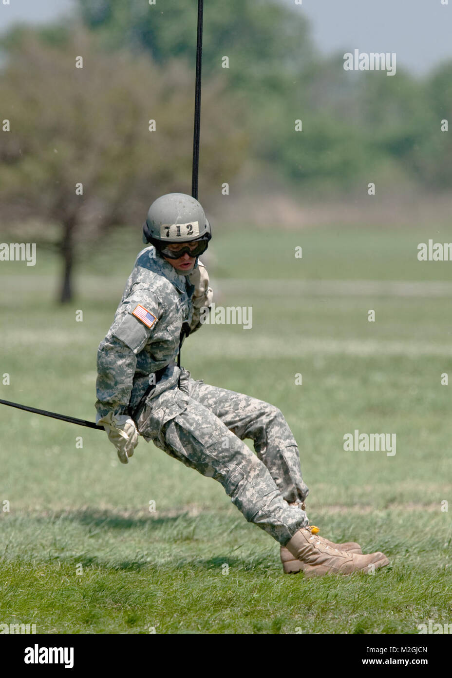 Students in the Army Air Assault School repel from a UH-60 helicopter ...