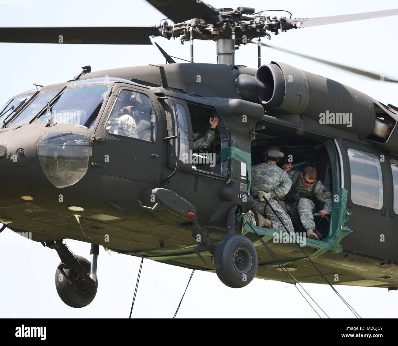 Students in the Army Air Assault School repel from a UH-60 helicopter ...