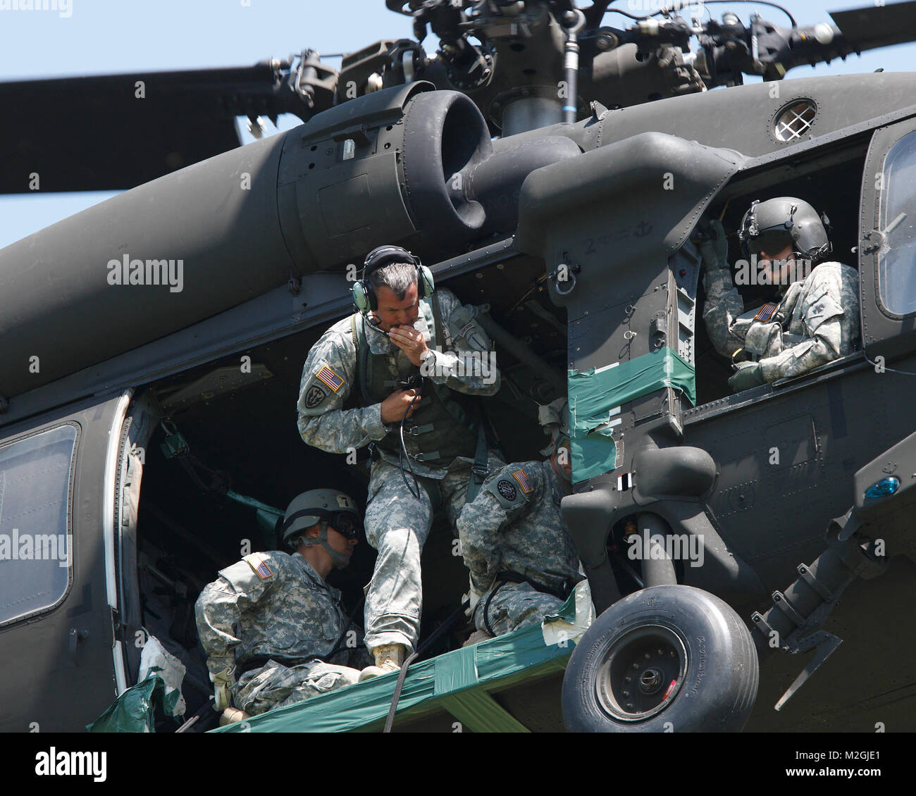 Students in the Army Air Assault School repel from a UH-60 helicopter ...