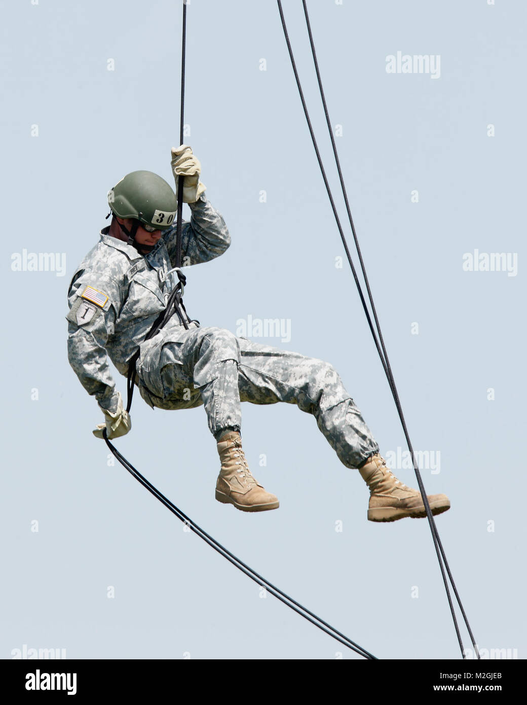 Students in the Army Air Assault School repel from a UH-60 helicopter ...