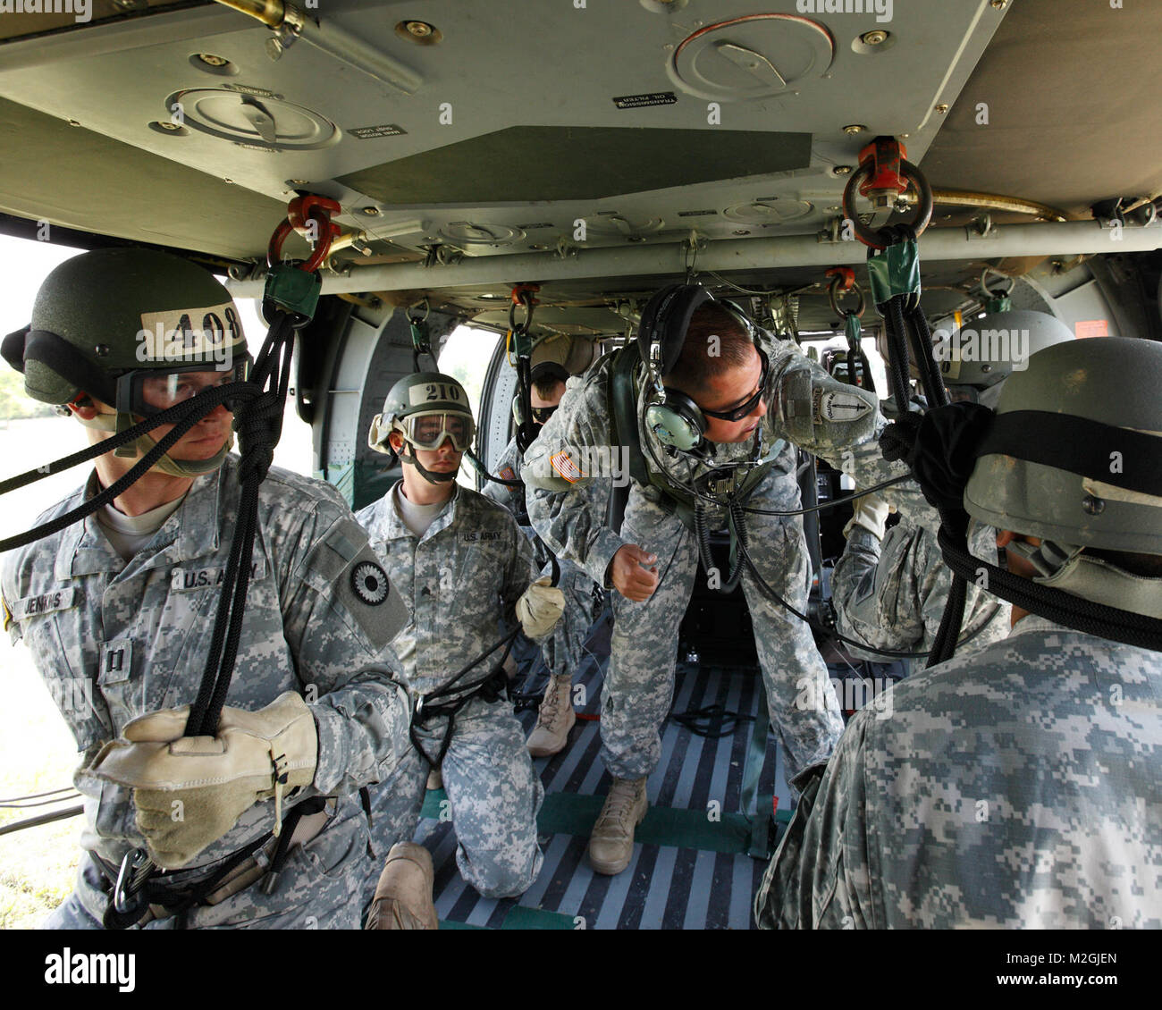 Students in the Army Air Assault School repel from a UH-60 helicopter ...