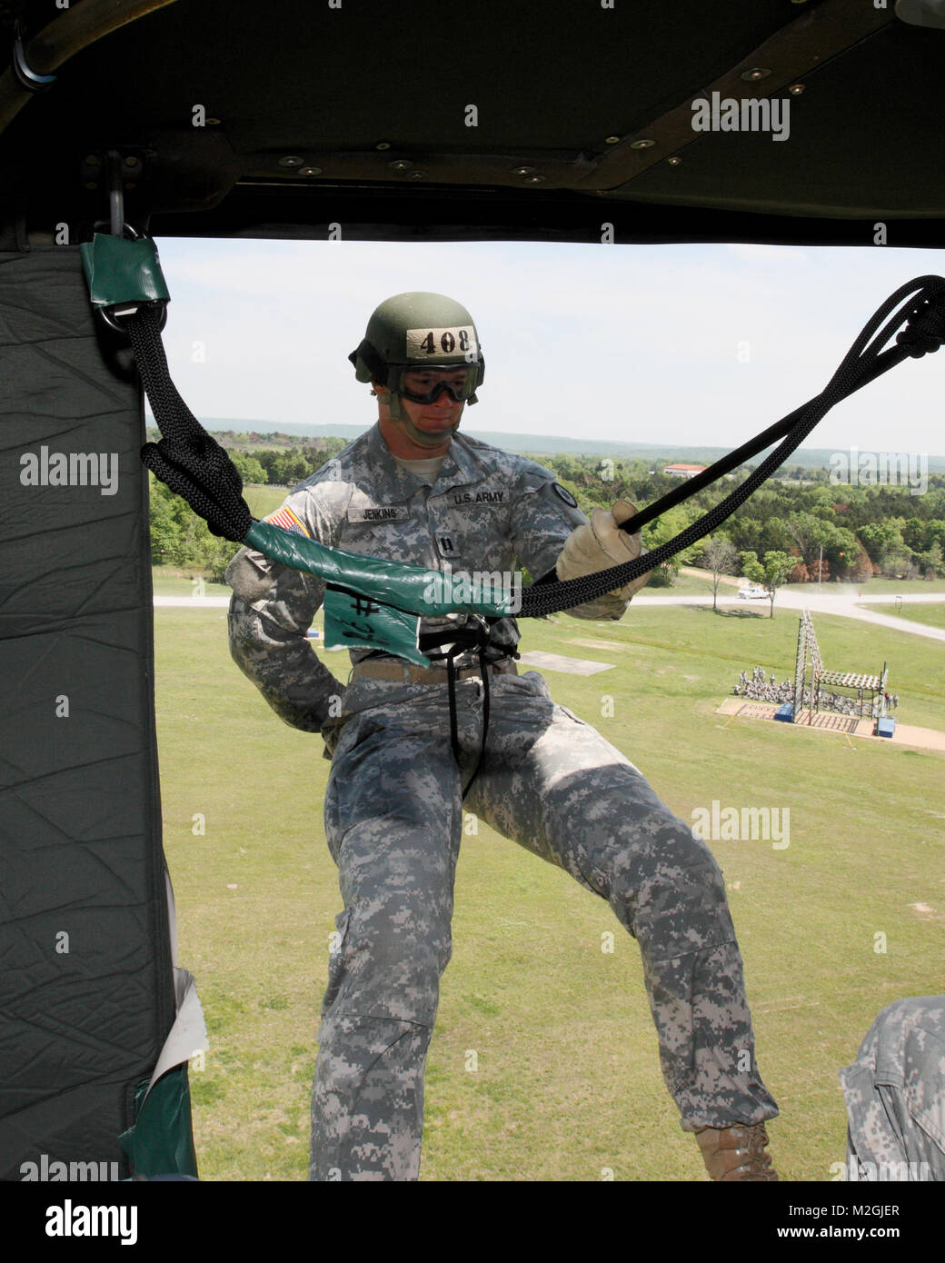Students in the Army Air Assault School repel from a UH-60 helicopter ...
