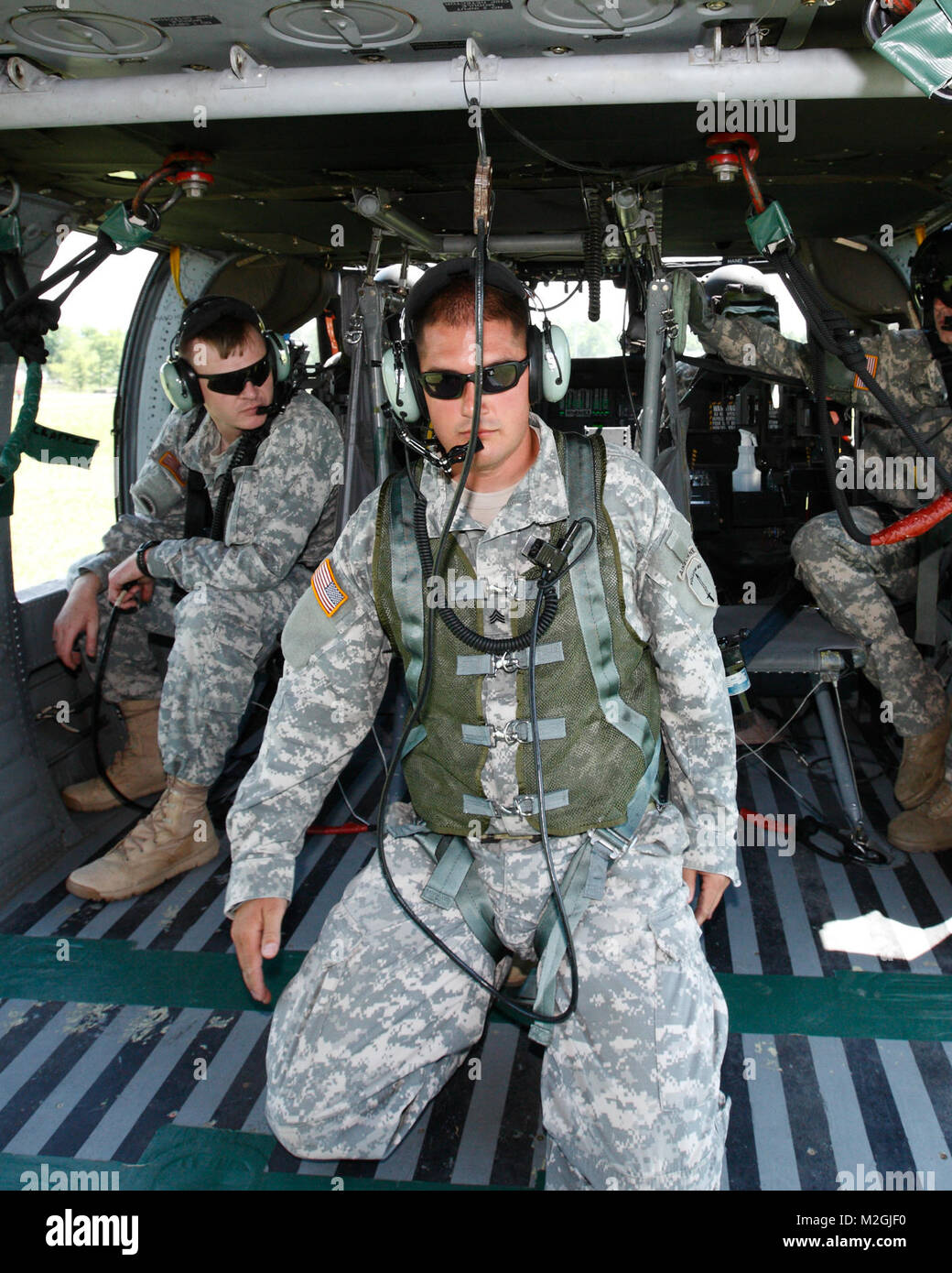 Students in the Army Air Assault School repel from a UH-60 helicopter ...