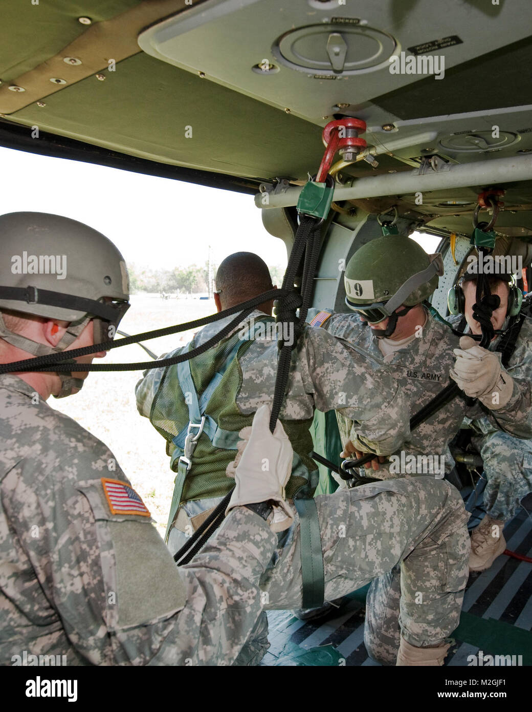 Students in the Army Air Assault School repel from a UH-60 helicopter ...