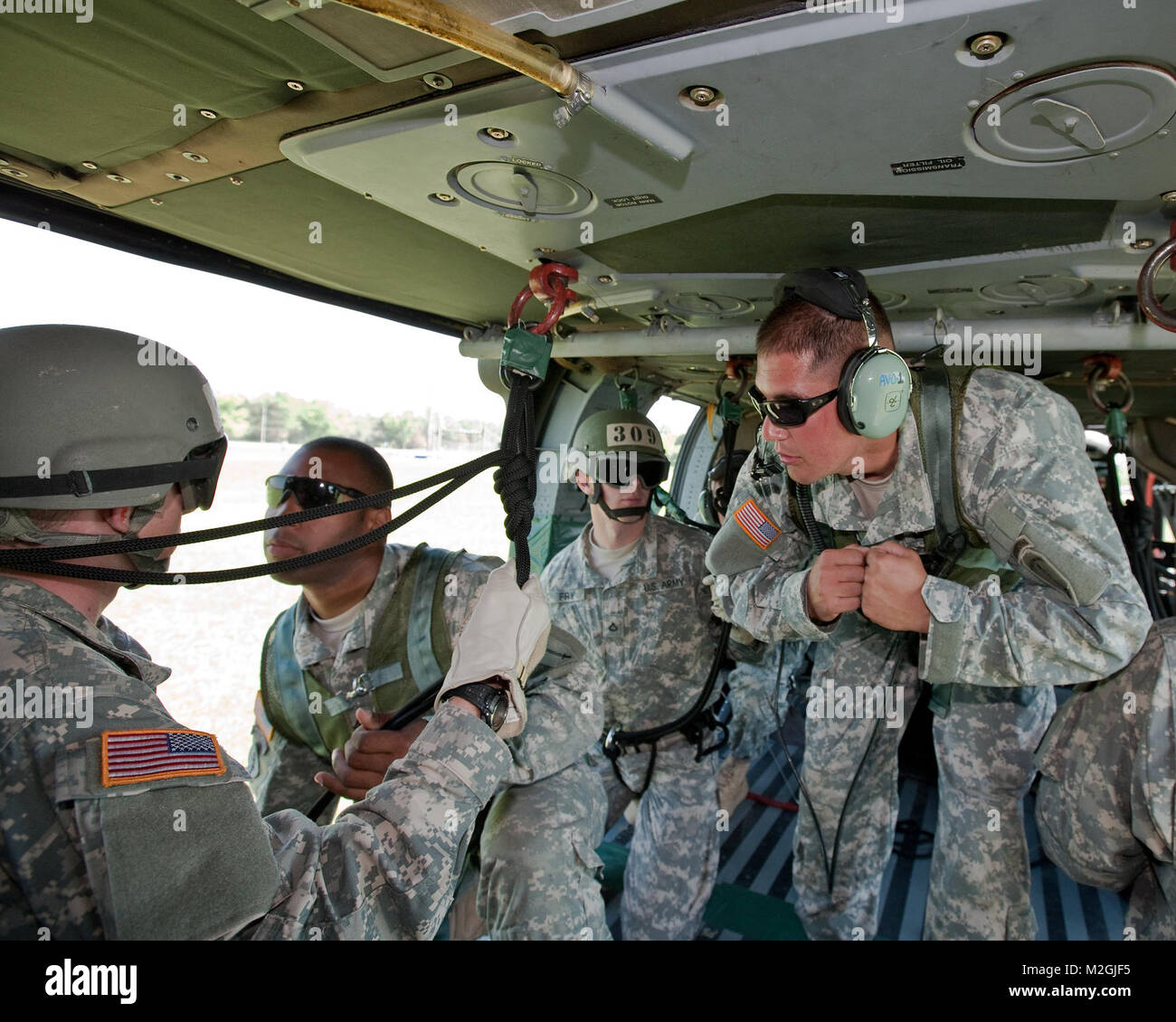 Students in the Army Air Assault School repel from a UH-60 helicopter ...