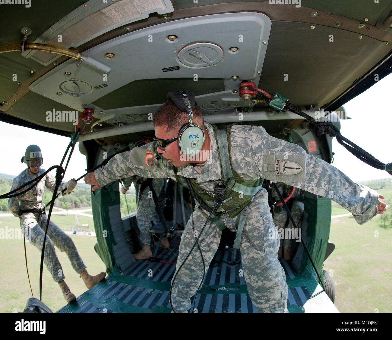 Students in the Army Air Assault School repel from a UH-60 helicopter ...