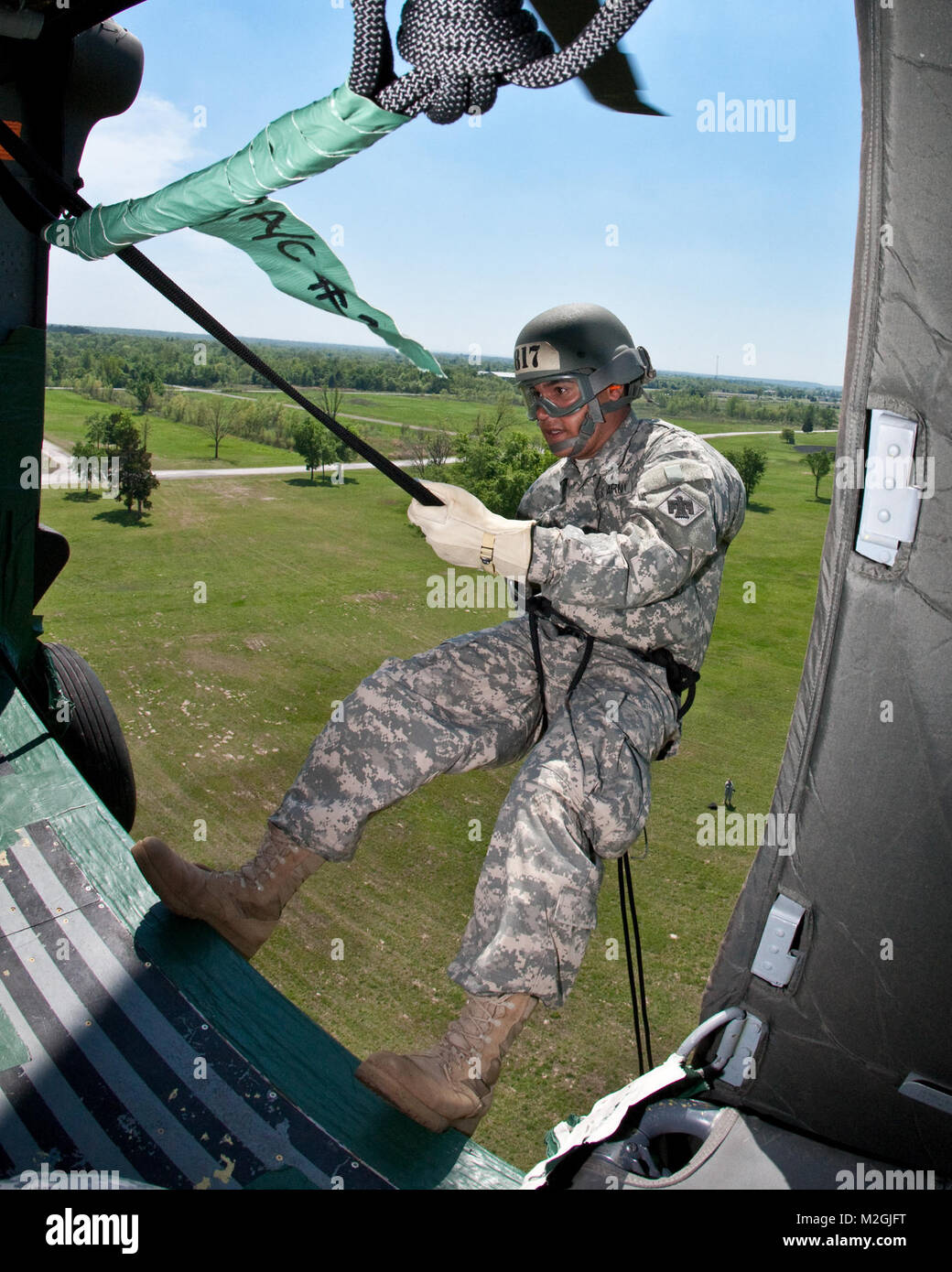 Students in the Army Air Assault School repel from a UH-60 helicopter ...